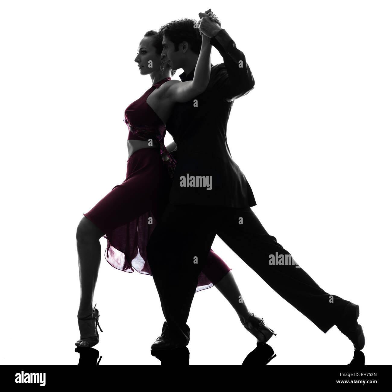 one couple man woman ballroom dancers tangoing in silhouette studio ...
