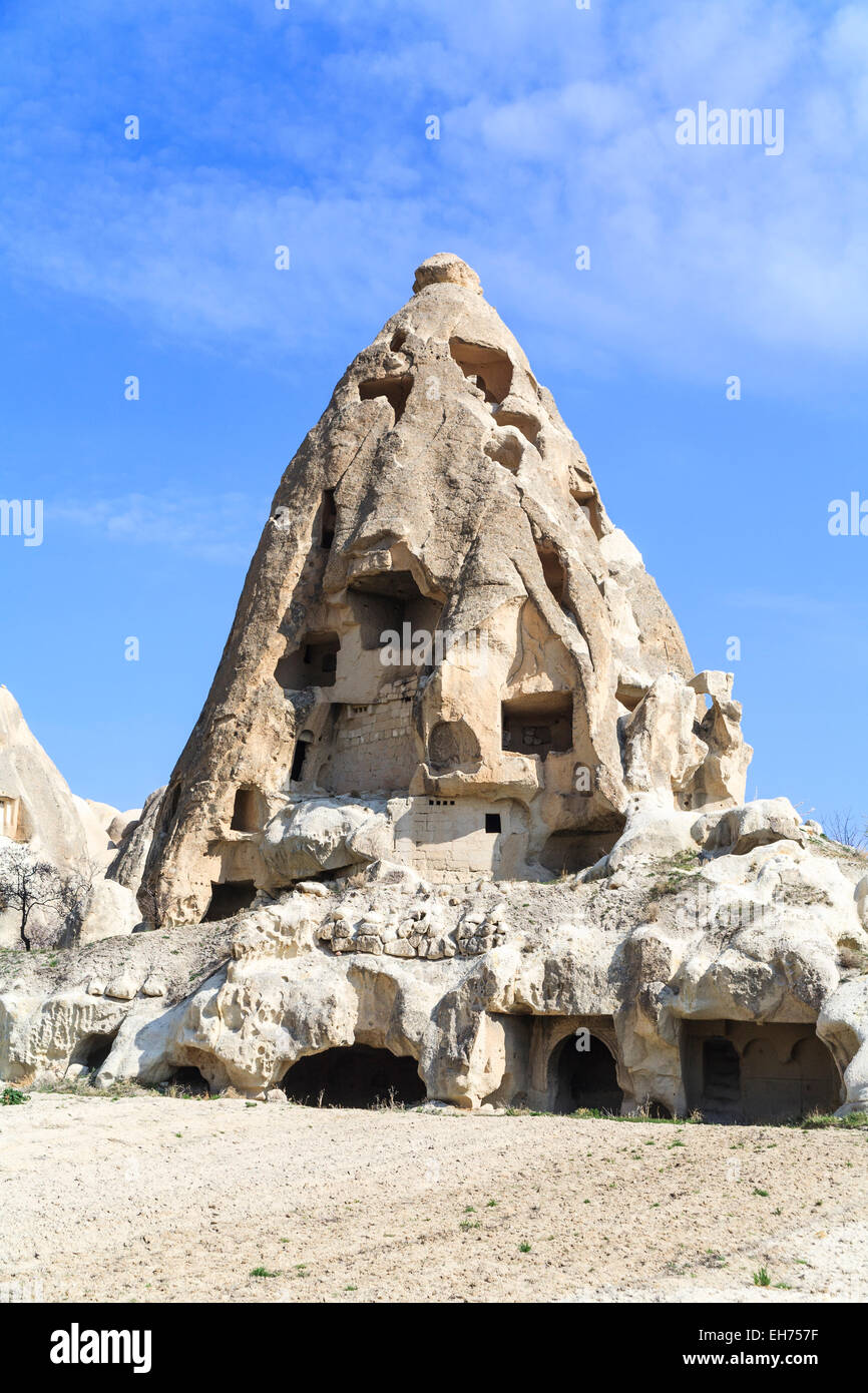 Fairy chimney rock formation with caves and remains of troglodyte ...