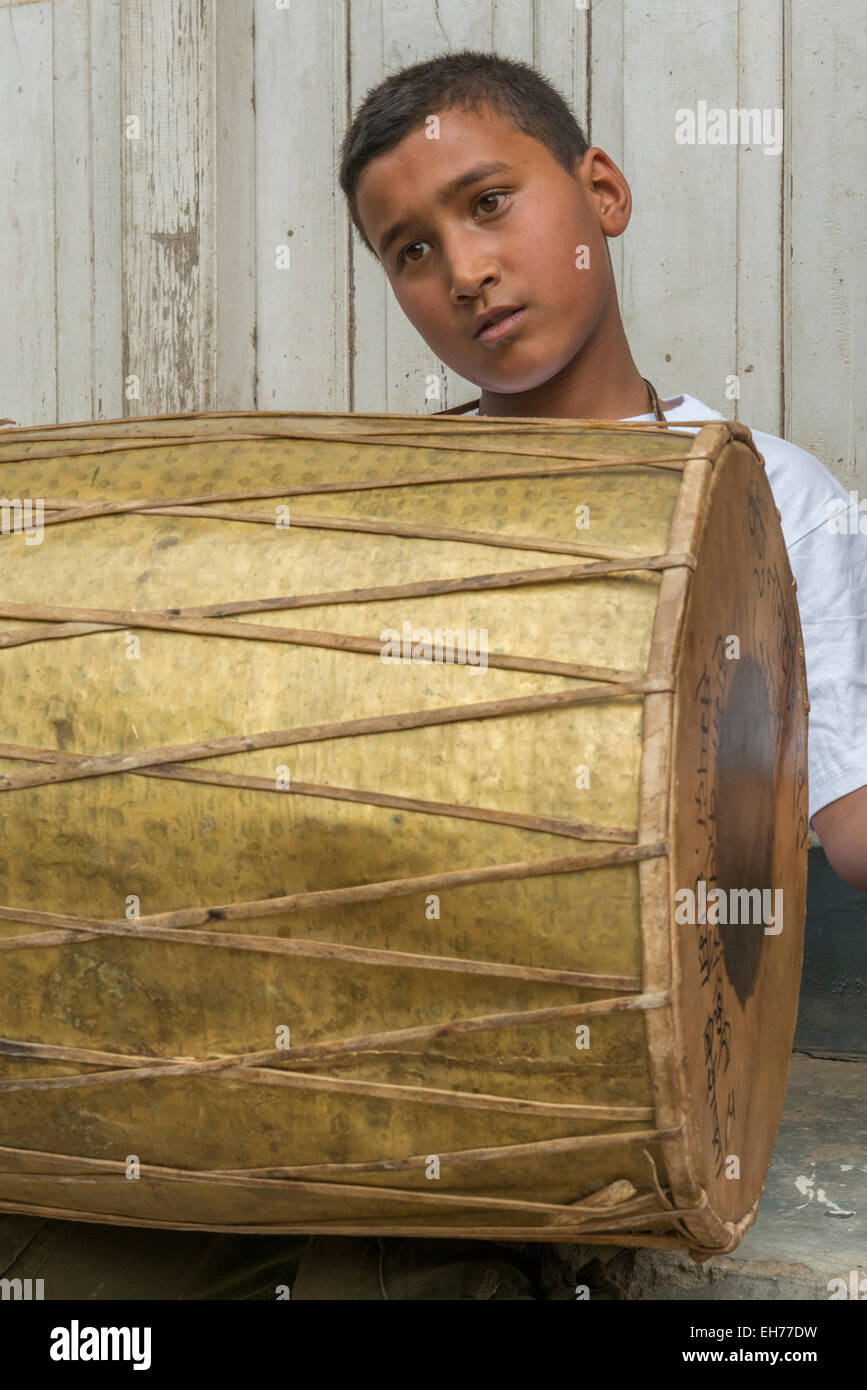 Boy with drums, Changu Narayan Temple Stock Photo - Alamy