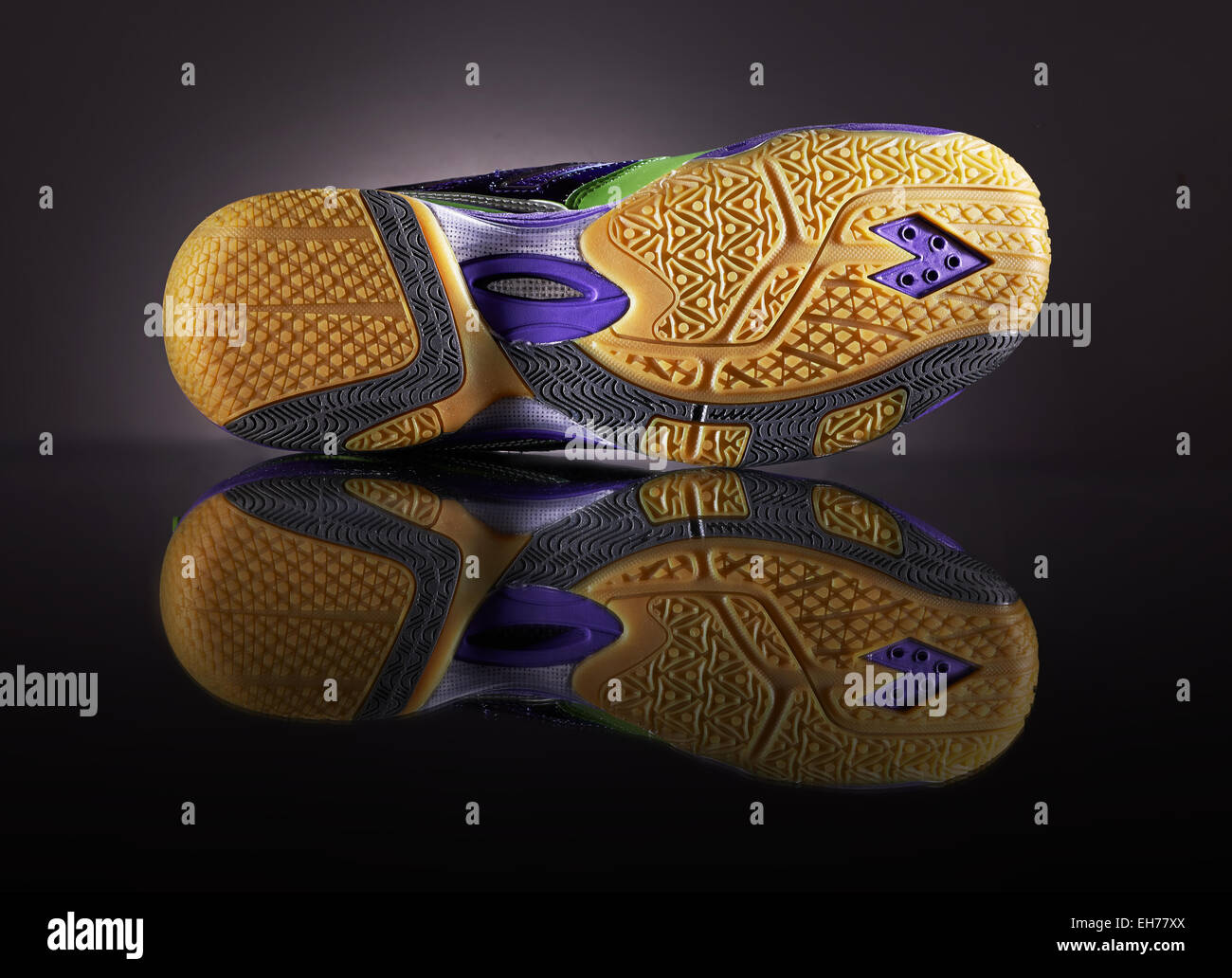 A bottom view of sport shoes with reflected surface Stock Photo - Alamy