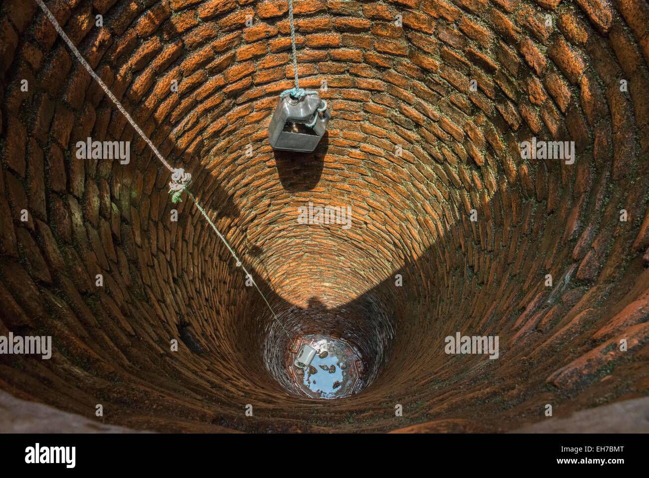 Brick made water well and rope-held containers, Bhaktapur Stock Photo ...