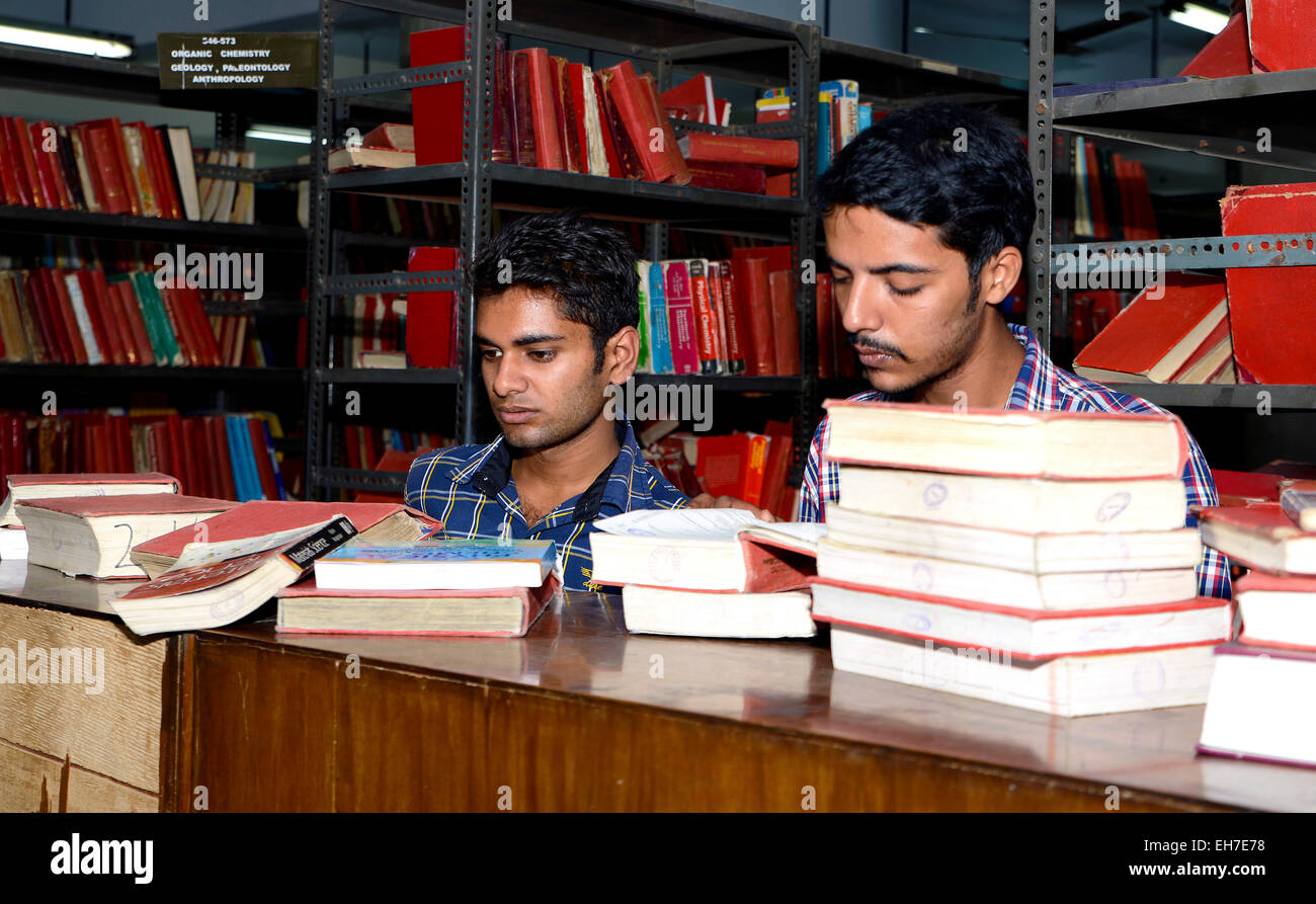 Student reading in Library Stock Photo - Alamy