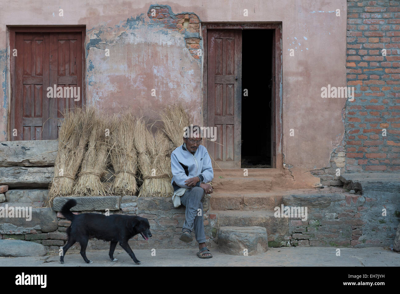Man on Doorstep, Bungamati Stock Photo - Alamy