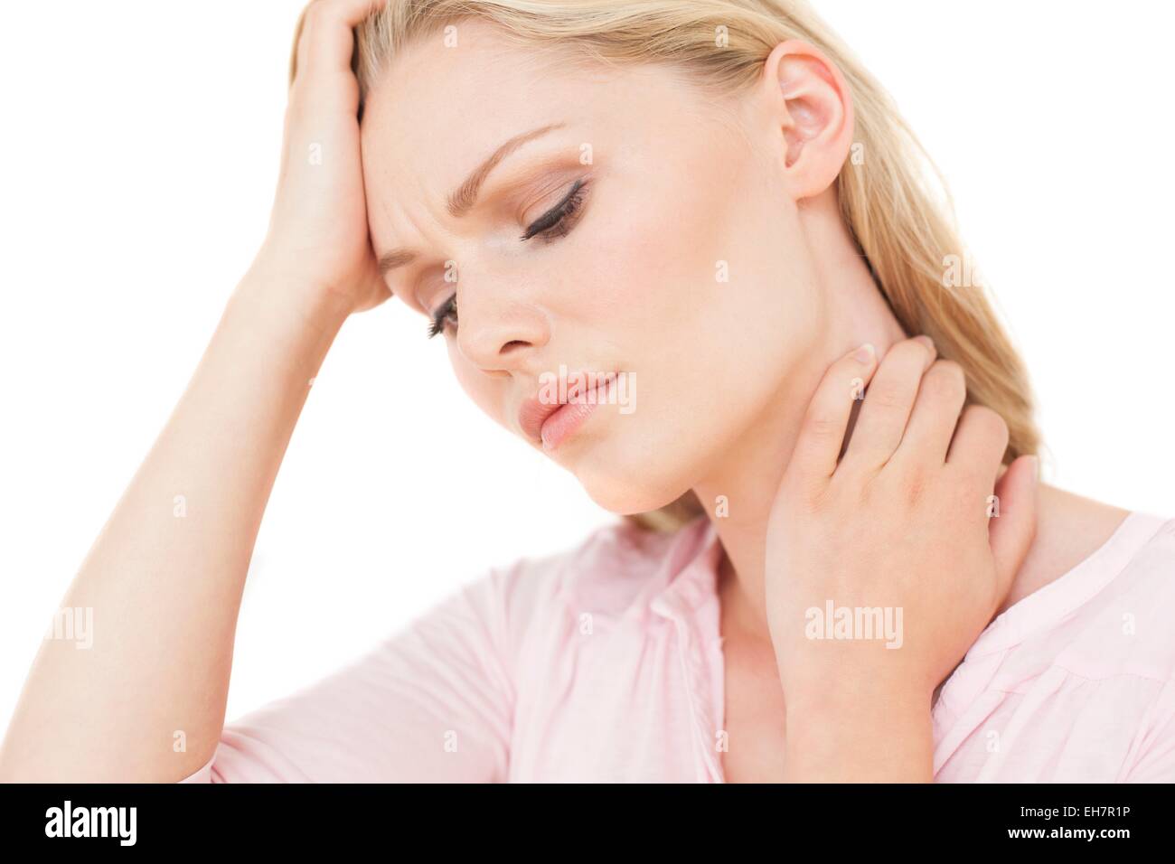 Woman with hand on neck Stock Photo - Alamy
