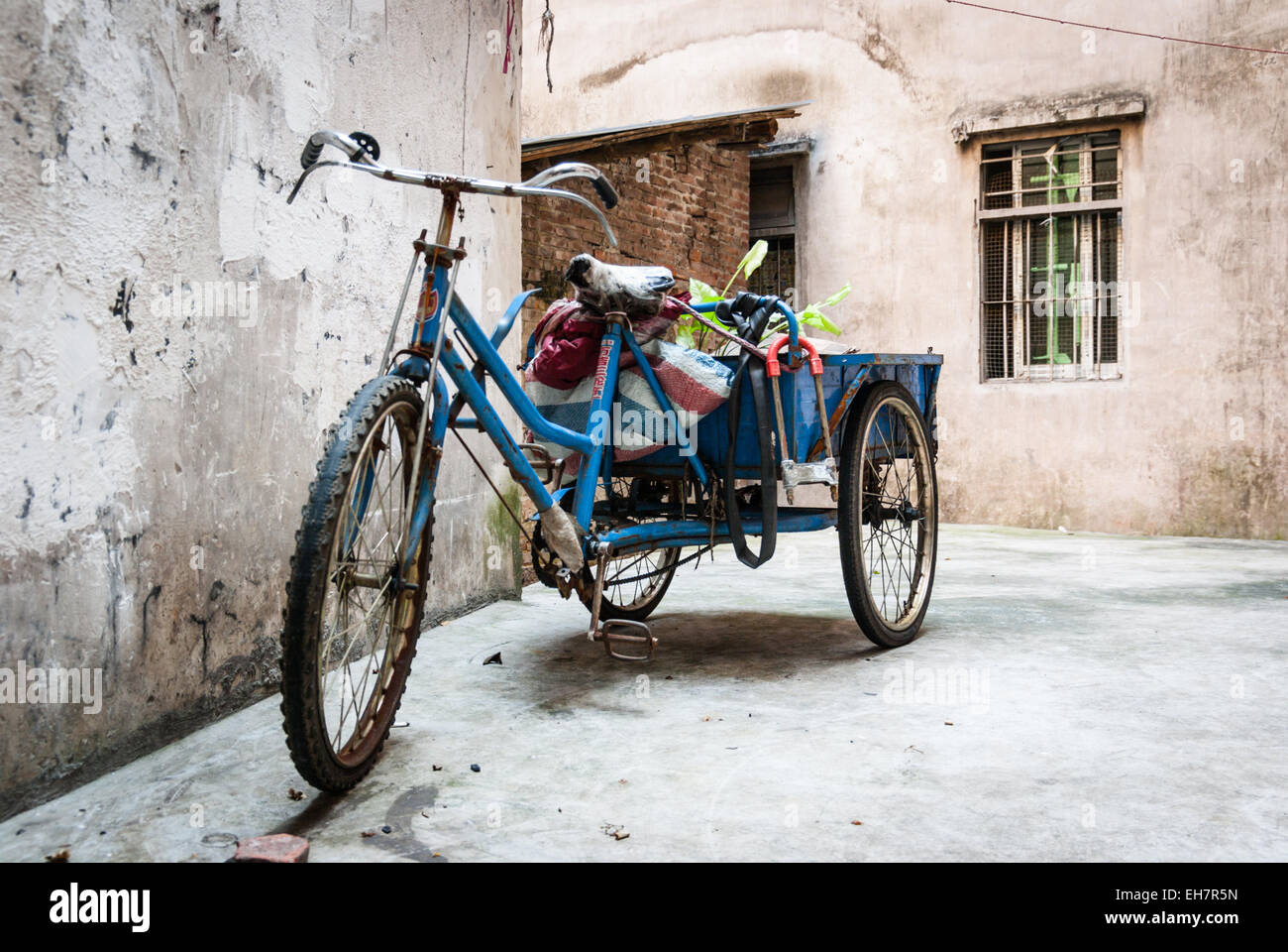 Delivery trikes service narrow lanes in old section of Guangzhou, China ...