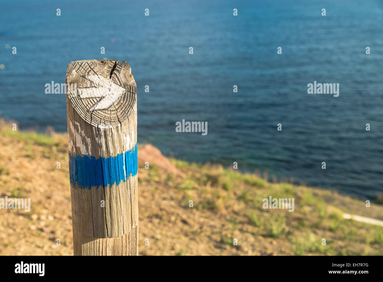 Wooden hiking guidepost against the background of the coast Stock Photo ...