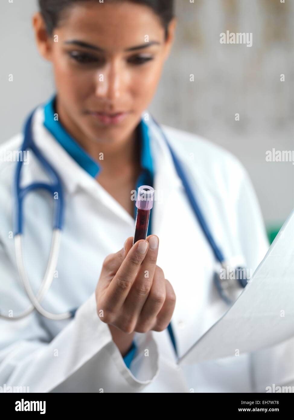 Doctor holding a blood sample Stock Photo - Alamy