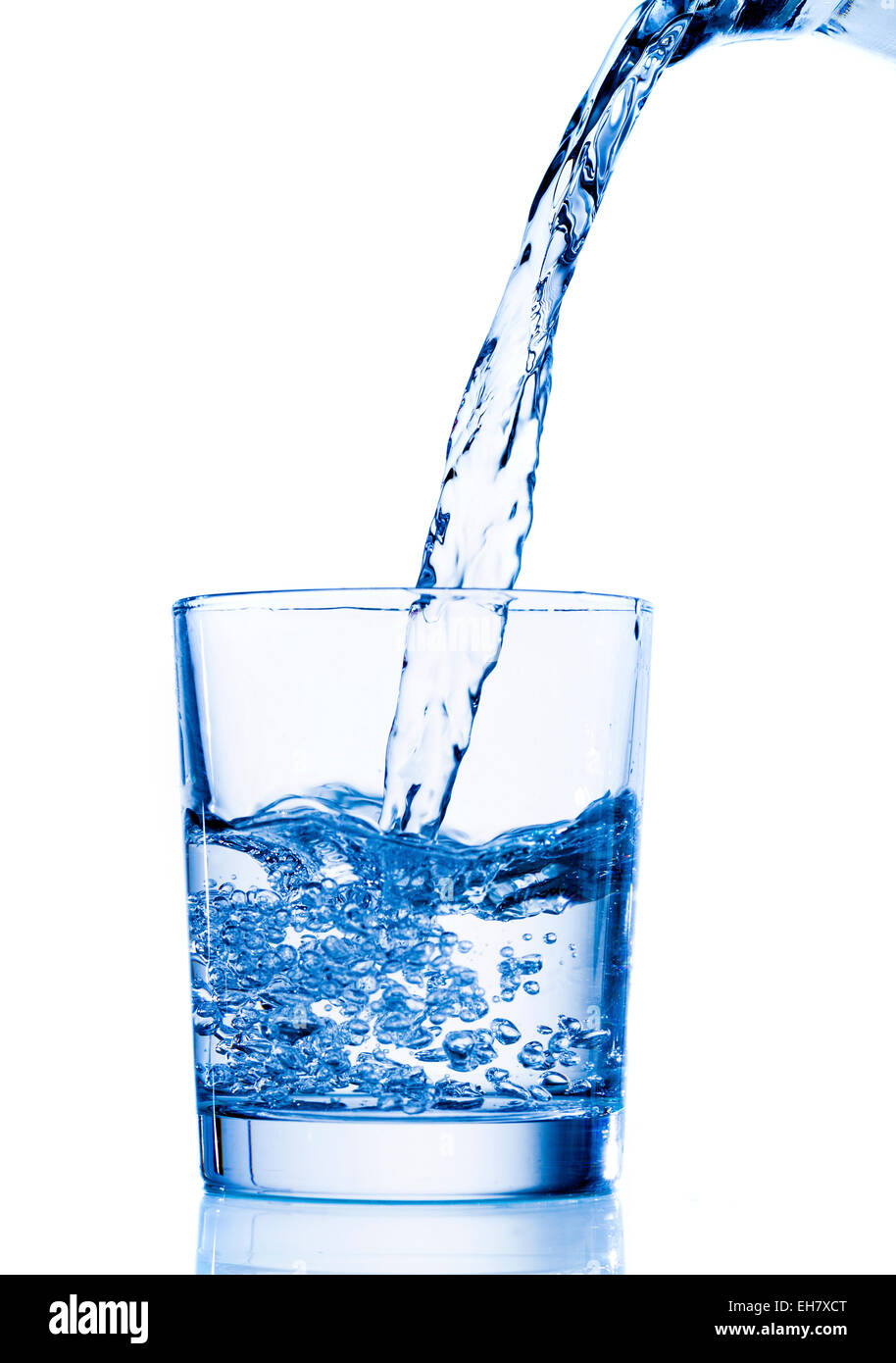Water being poured into a glass Stock Photo - Alamy