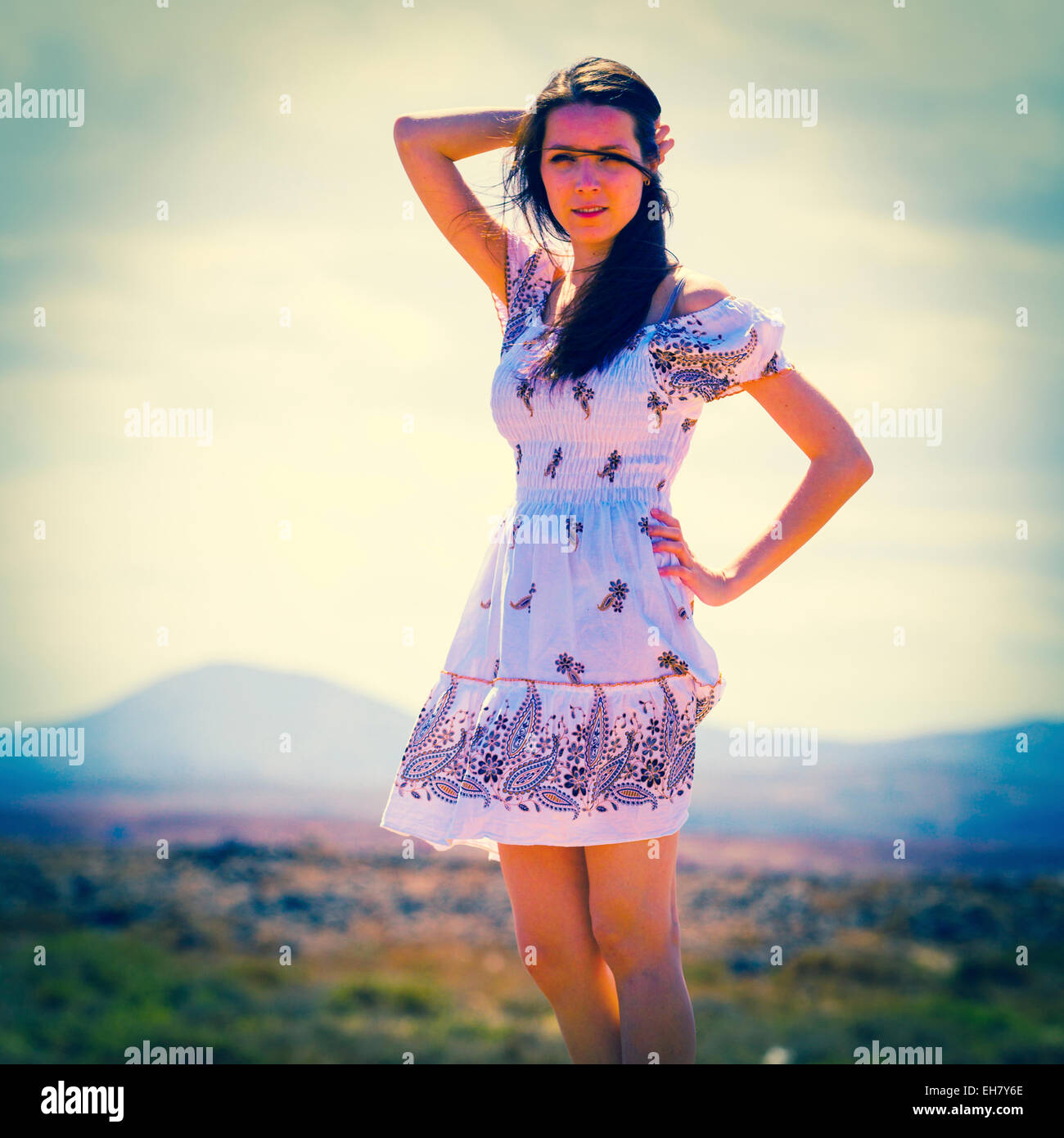 Woman windy day dress High Resolution Stock Photography and Images - Alamy