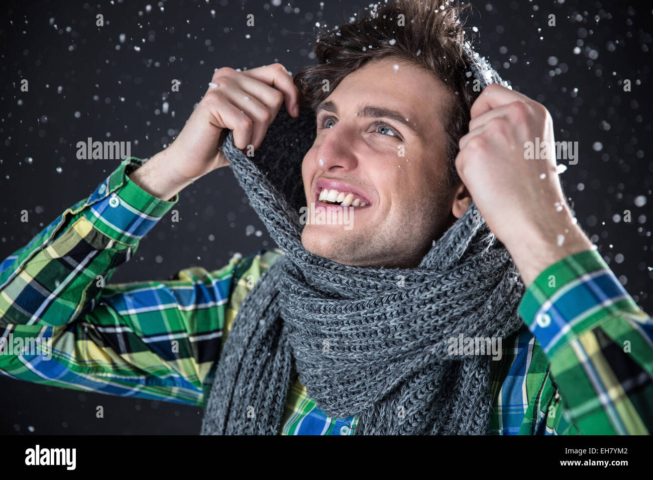Smiling handsome man with snow on background. Winter coming Stock Photo ...