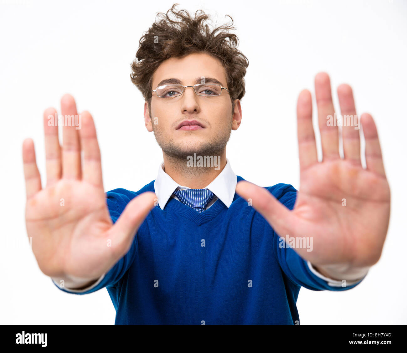 Confident business man showing stop gesture over white background Stock ... Confident business man showing stop gesture over white background Stock ...
