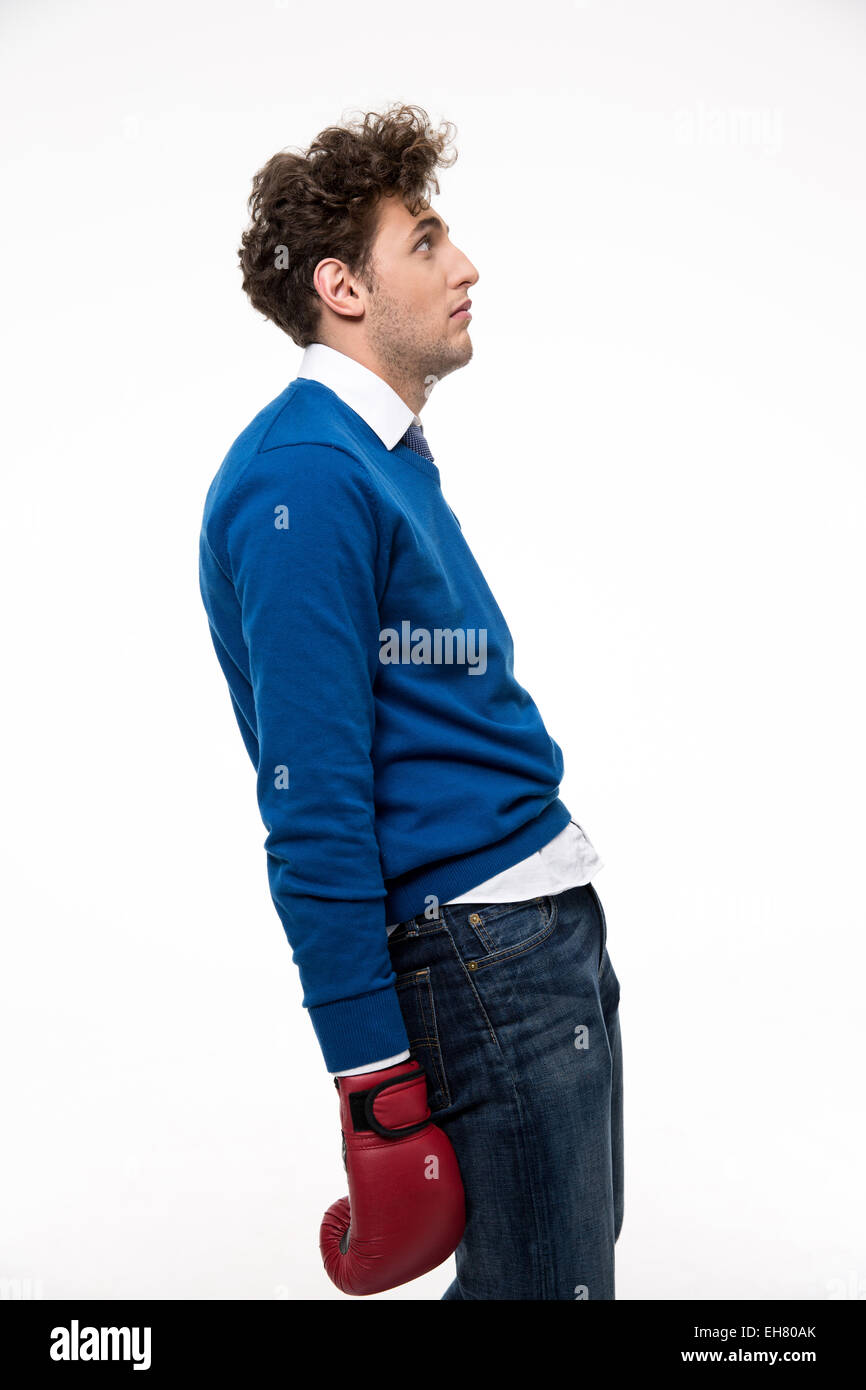 Side view portrait of a defeated young man over white background Stock ...