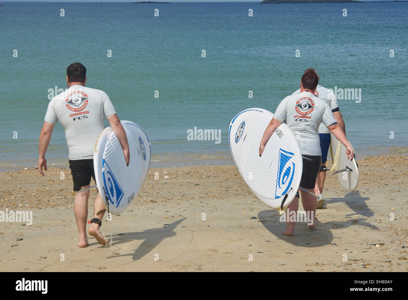 Women walking surfboards sea beach hi-res stock photography and images ...