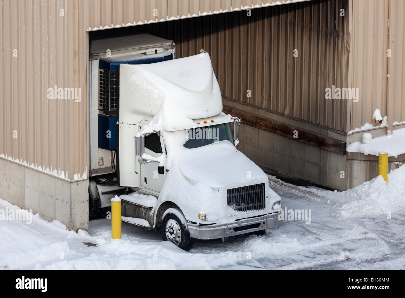 Semi truck and the warehouse seen winter time. Illinois, USA Stock ...