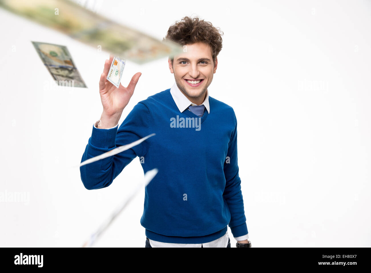 Happy man enjoying a rain of money Stock Photo - Alamy