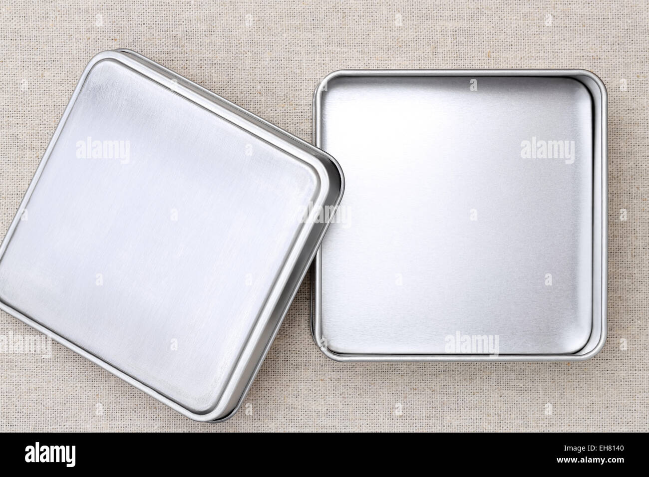 Empty metal box on burlap background Stock Photo - Alamy