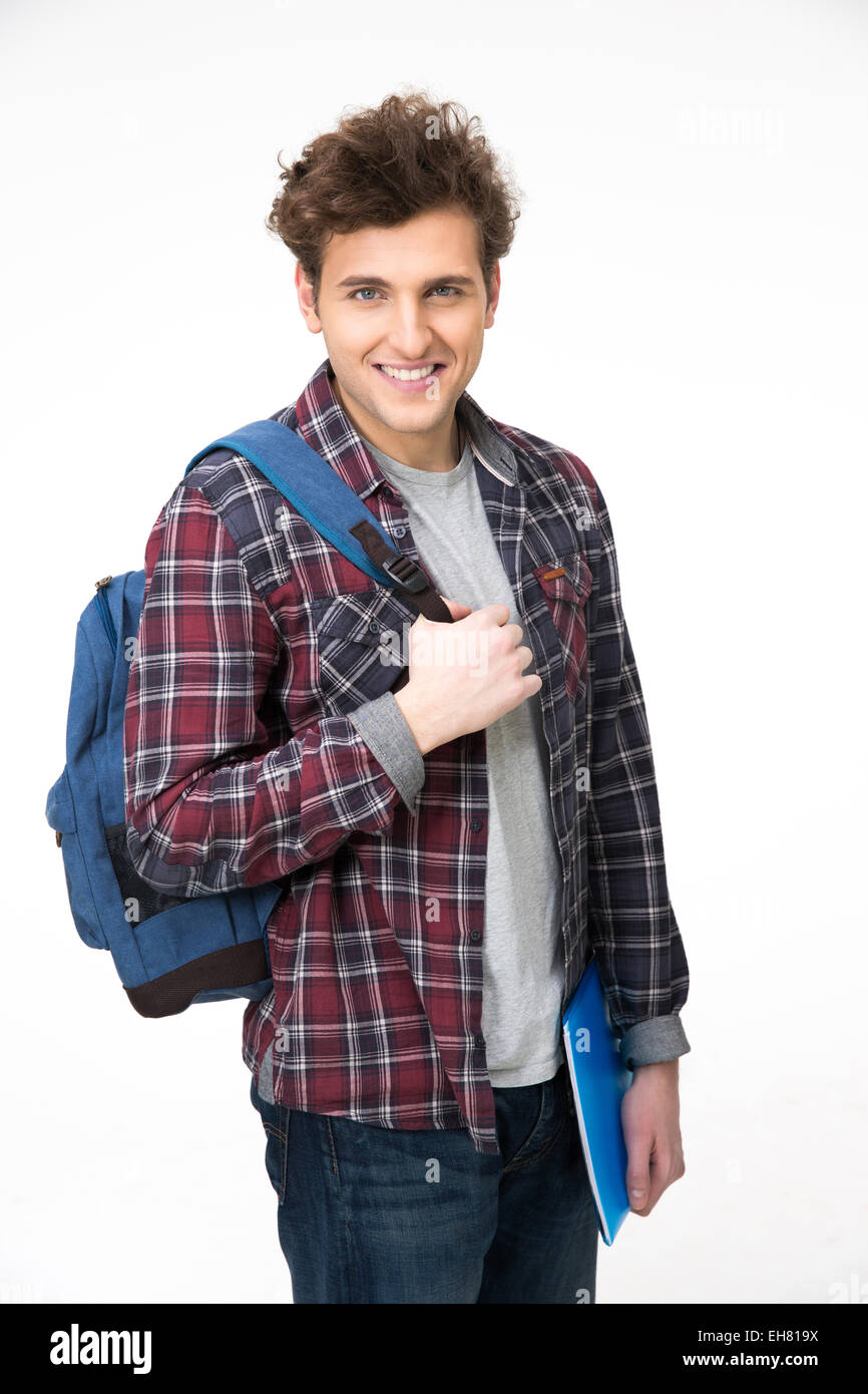 Happy male student standing over gray background Stock Photo - Alamy