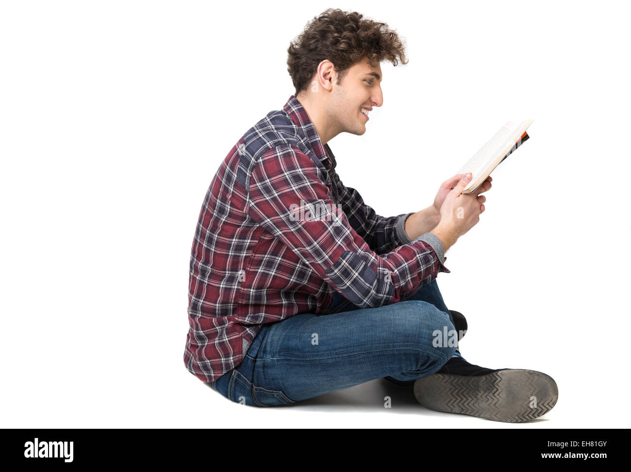 Young man opened book reading Cut Out Stock Images & Pictures - Alamy