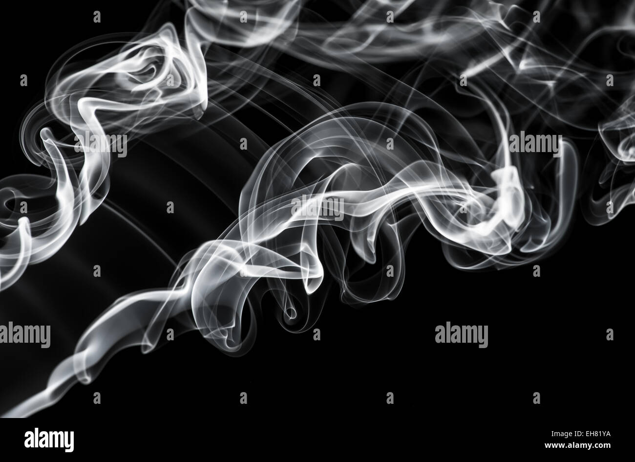 Abstract fume pattern: white smoke swirls and curves on black Stock ...