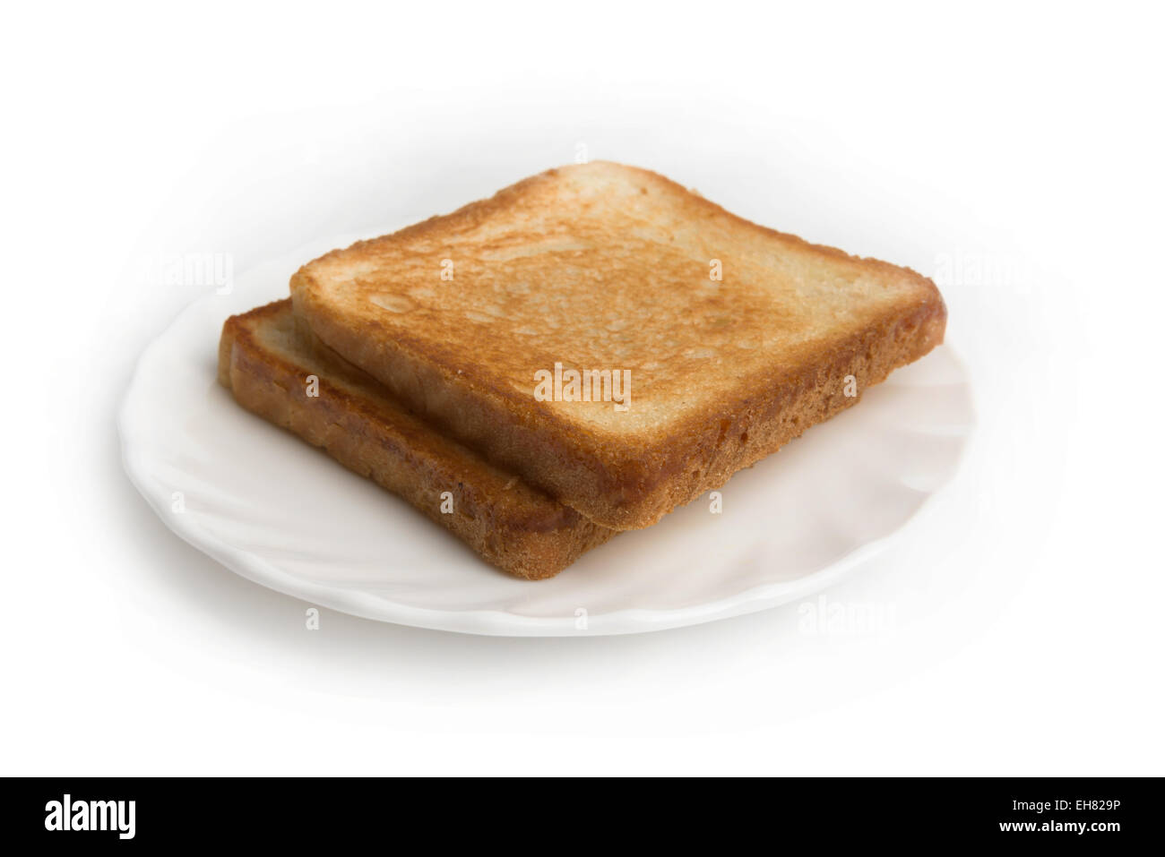 toasted bread on a plate isolated white background Stock Photo - Alamy