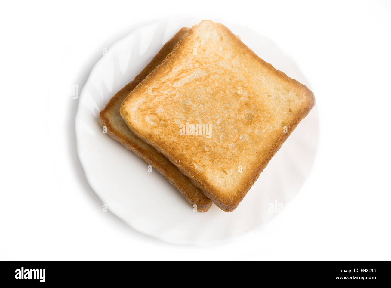 toasted bread on a plate isolated white background Stock Photo - Alamy