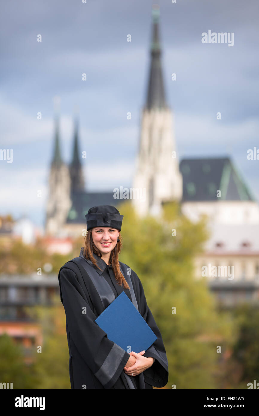 Pretty, young woman on her graduation day, with her diploma Stock Photo ...