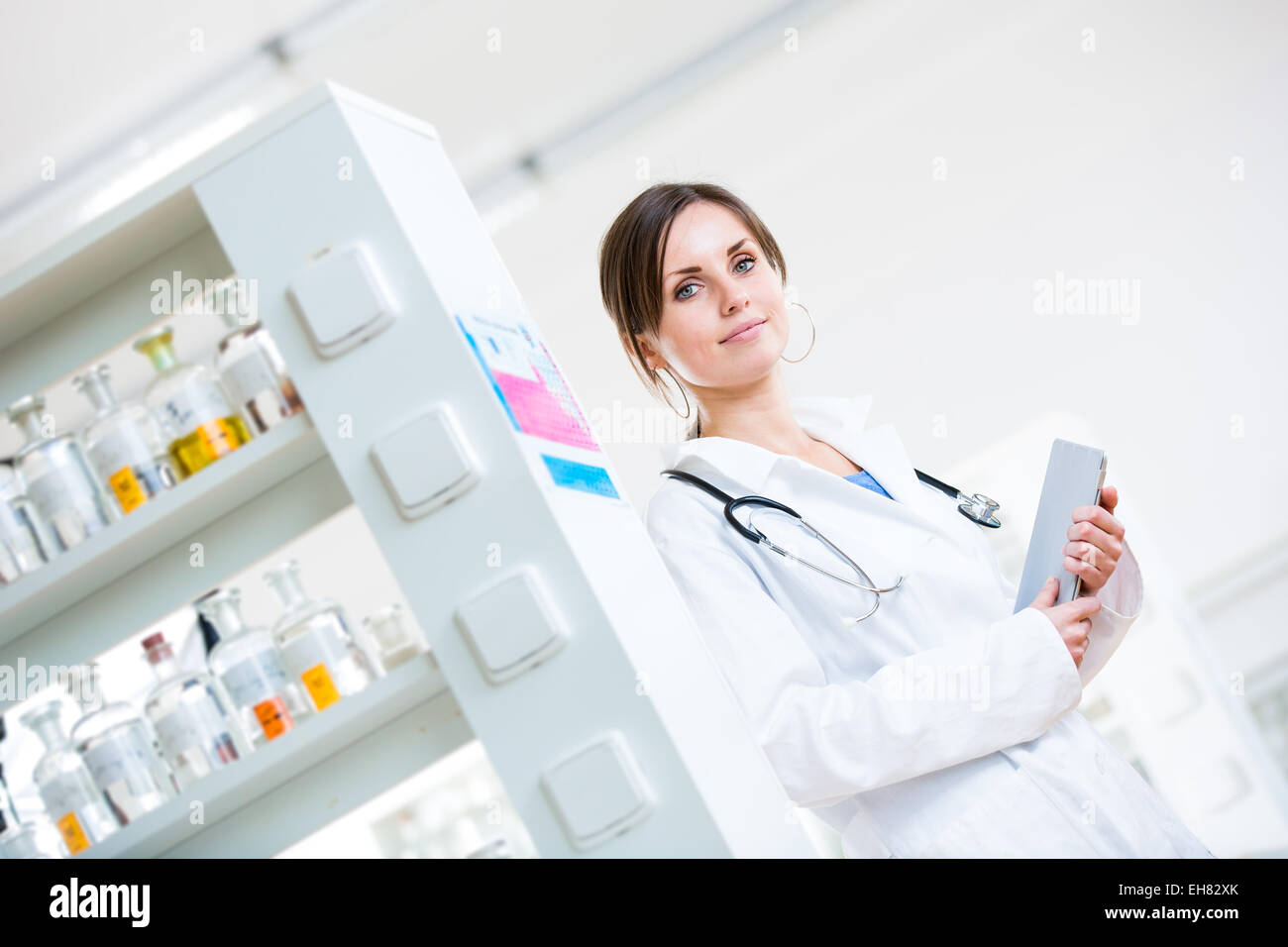 Pretty, female doctor in a hospital lab (image with copy space; color ...