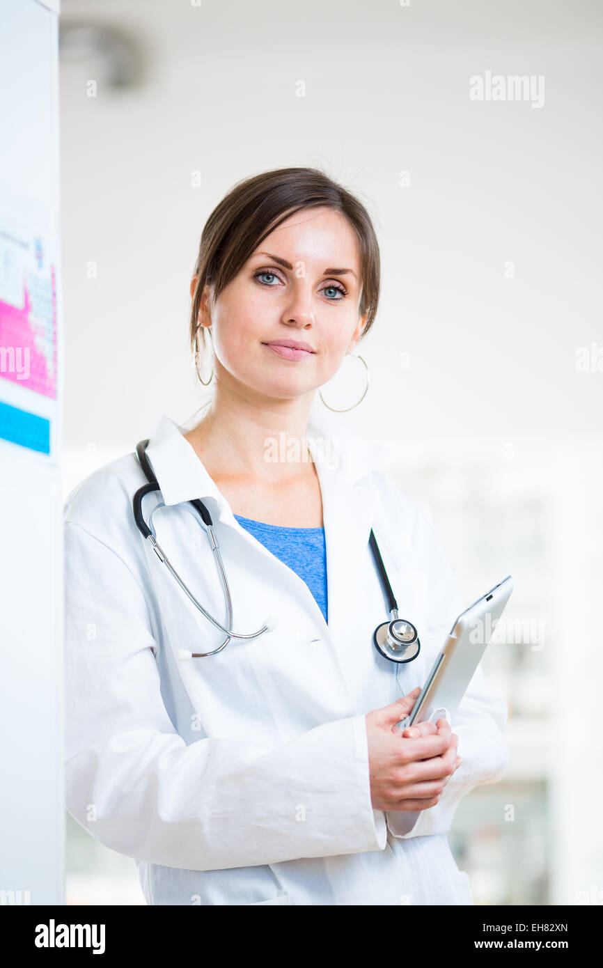 Pretty, female doctor in a hospital lab (image with copy space; color ...