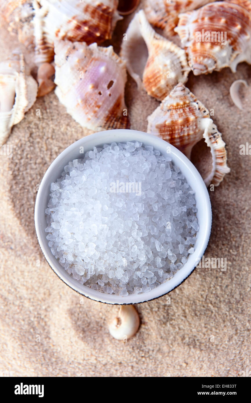 Sea salt and shells on sand Stock Photo - Alamy