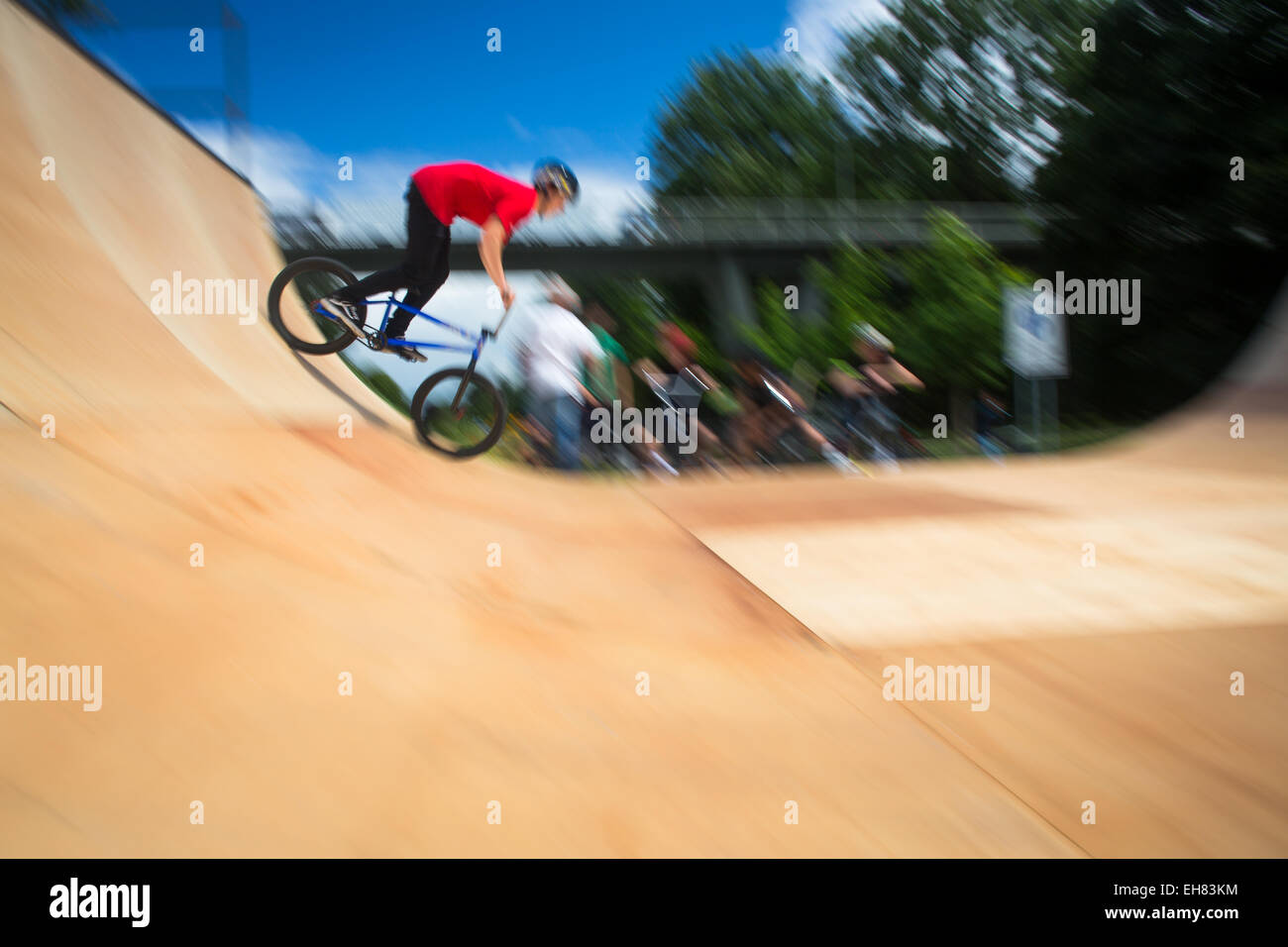 BMX Biker Performing Tricks during ride on a ramp Stock Photo - Alamy