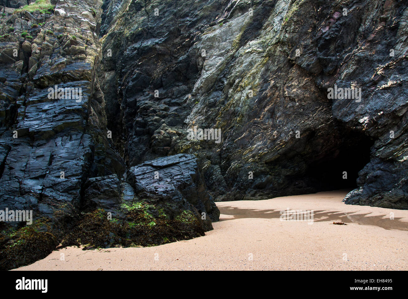 Mysterious cave in the cliffs at Crantock beach near Newquay in ...