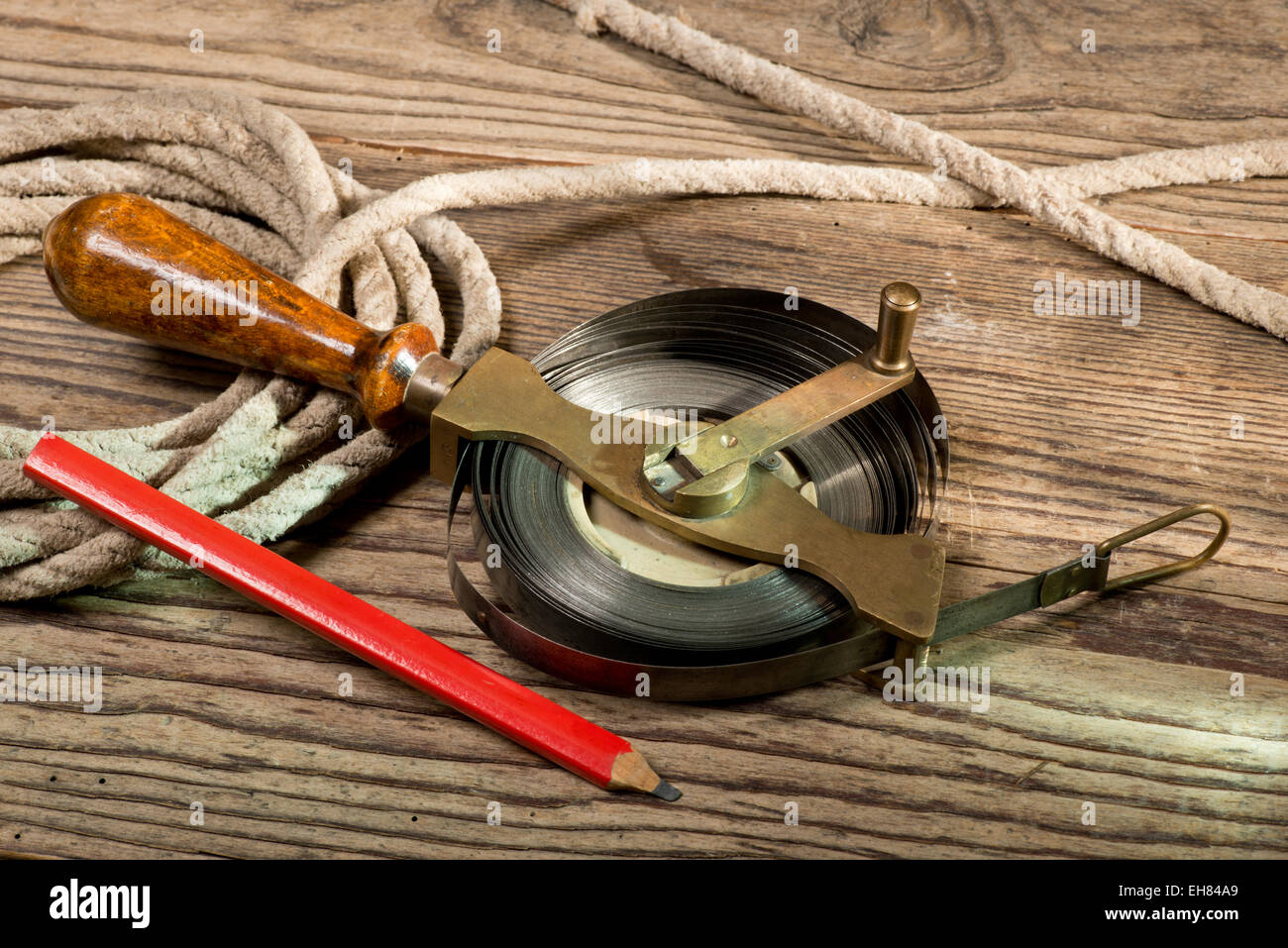 still life with tape measure and old rope Stock Photo - Alamy