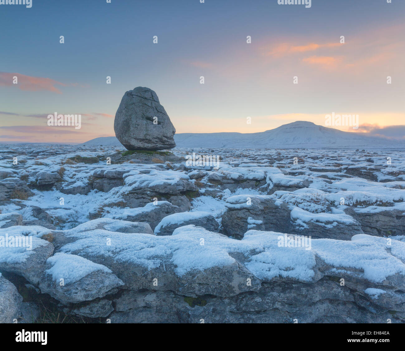 Giant glacial erratic boulder with a view towards Ingleborough with ...