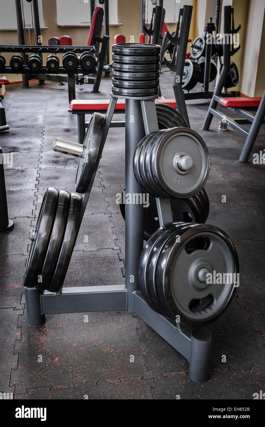 Barbell plates rack Stock Photo - Alamy
