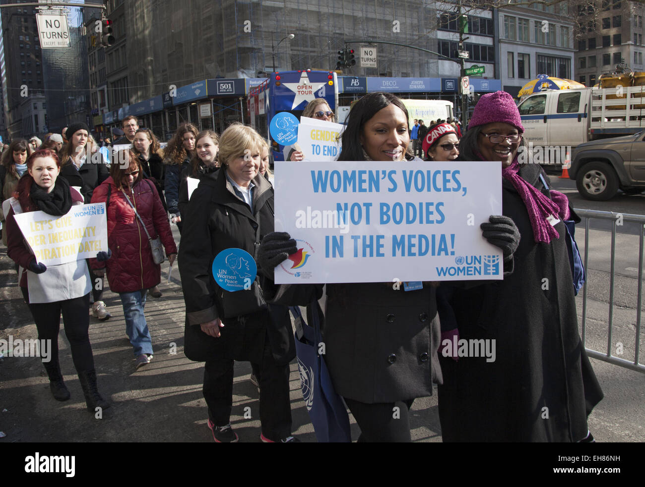 New York, USA. 8th March, 2015. Women and men marched thru midtown ...