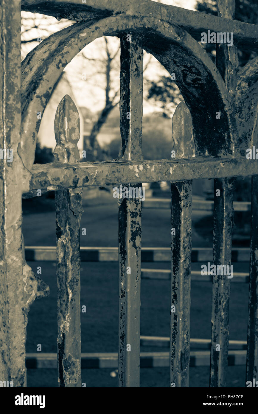 Aged heavy iron gate leading into a graveyard Stock Photo - Alamy