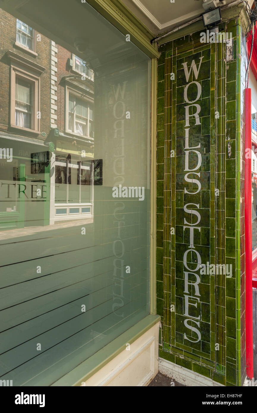 Old shop front advertising Worlds stores printed on green glazed tiles ...