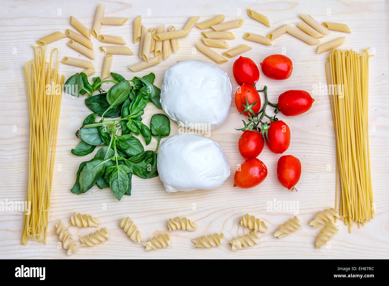 Composition with the bright colours of Italian food: pasta, spaghetti ...