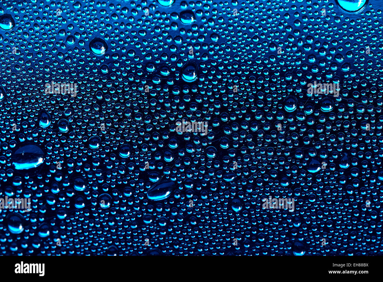 Water drops in blue color Stock Photo - Alamy