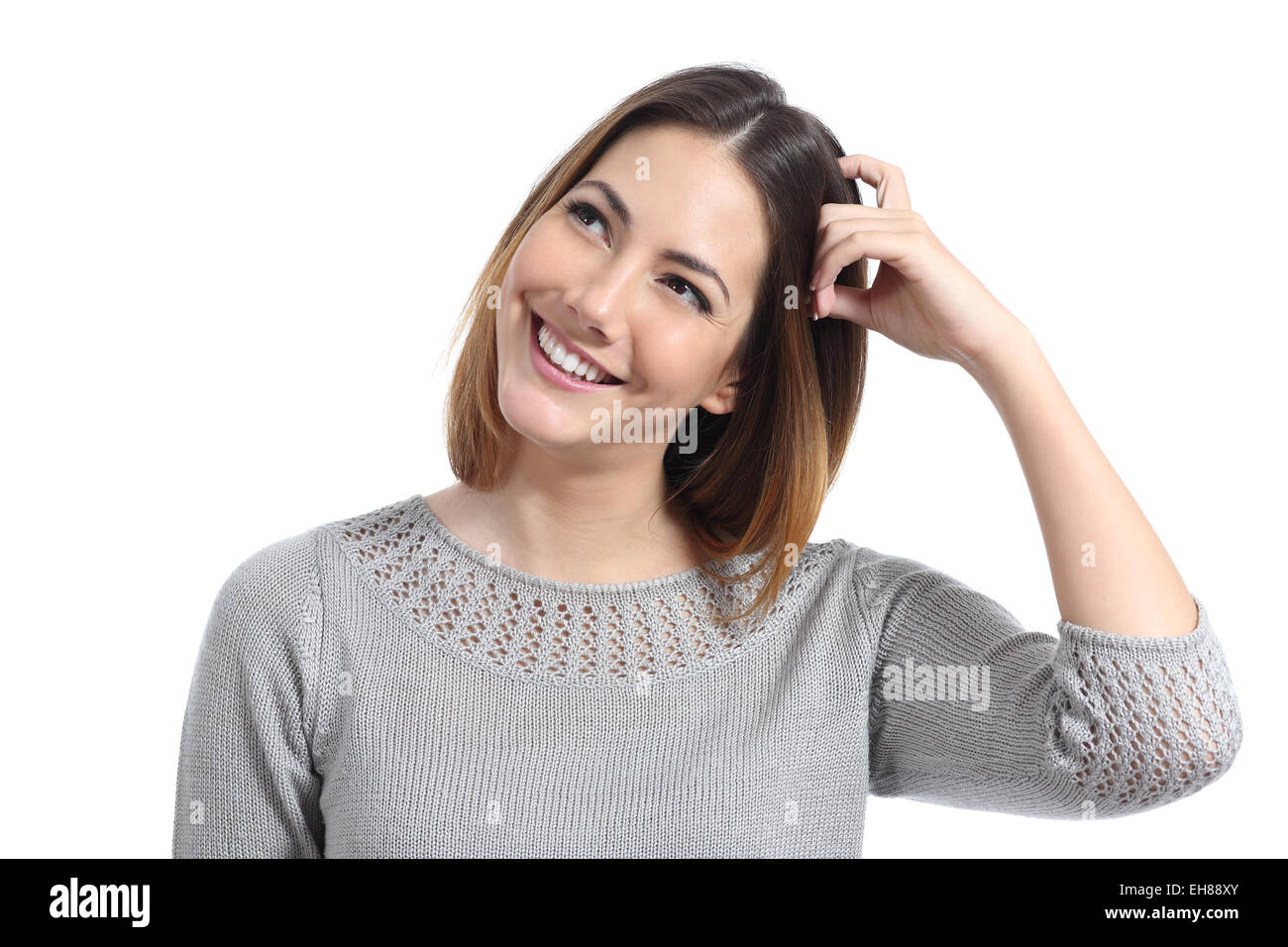 Pensive woman thinking and looking at side isolated on a white ...