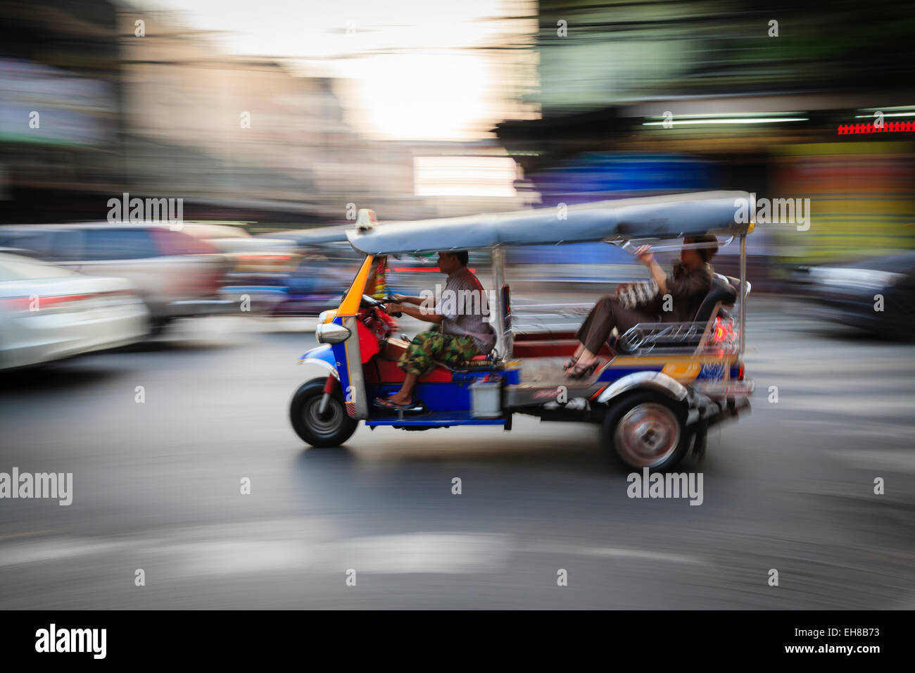 Tuk-tuk driving fast in Chinatown. Bangkok. Thailand Stock Photo - Alamy