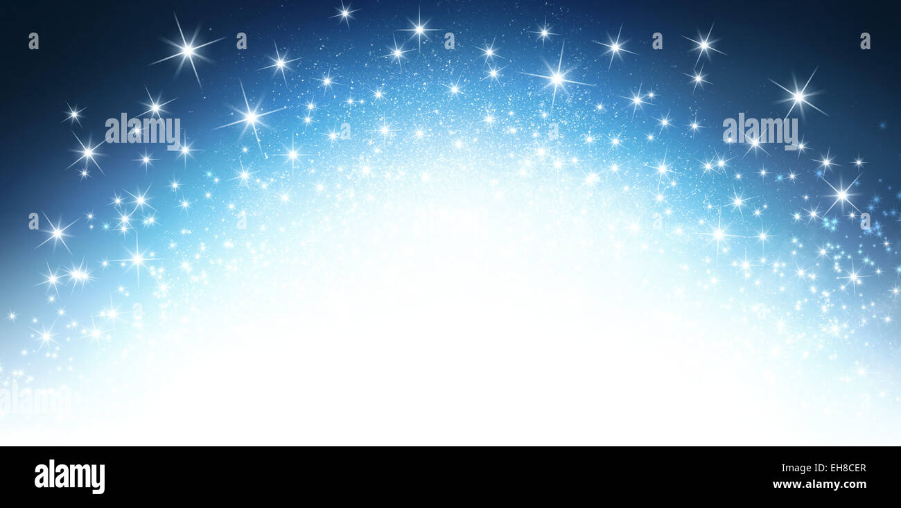 Festive sparkling lights. Shiny blue background in explosive starlight ...