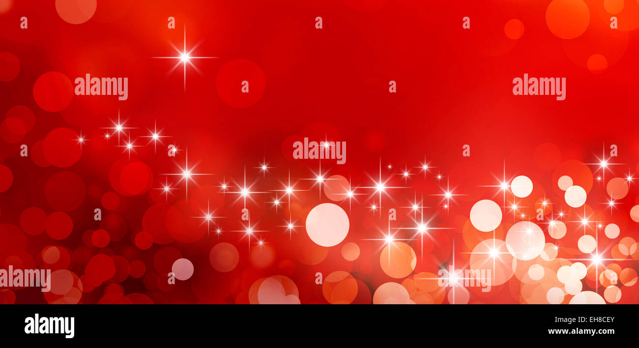 Festive sparkling lights. Shiny red background in starlight and ...