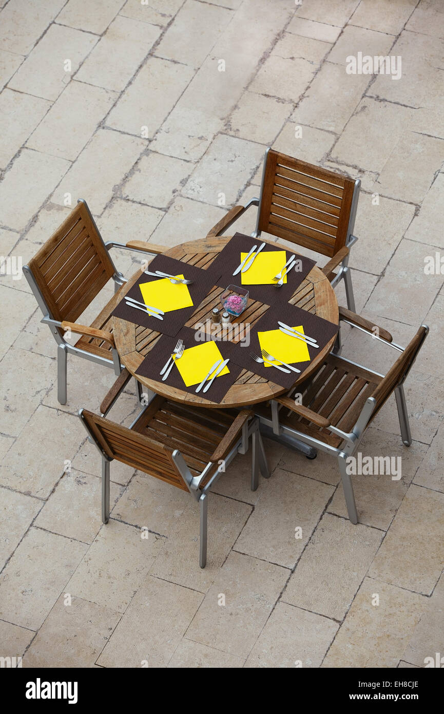 Outdoor summer cafe tables with chairs. View from above. Copy space ...