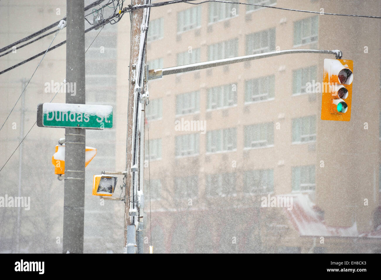 Snow covered sign and traffic light in London, Ontario in Canada Stock ...
