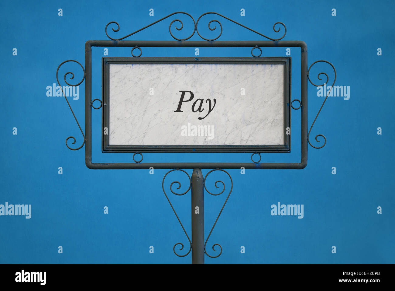 The Word "Pay" on a Signboard. Blue Background Stock Photo - Alamy