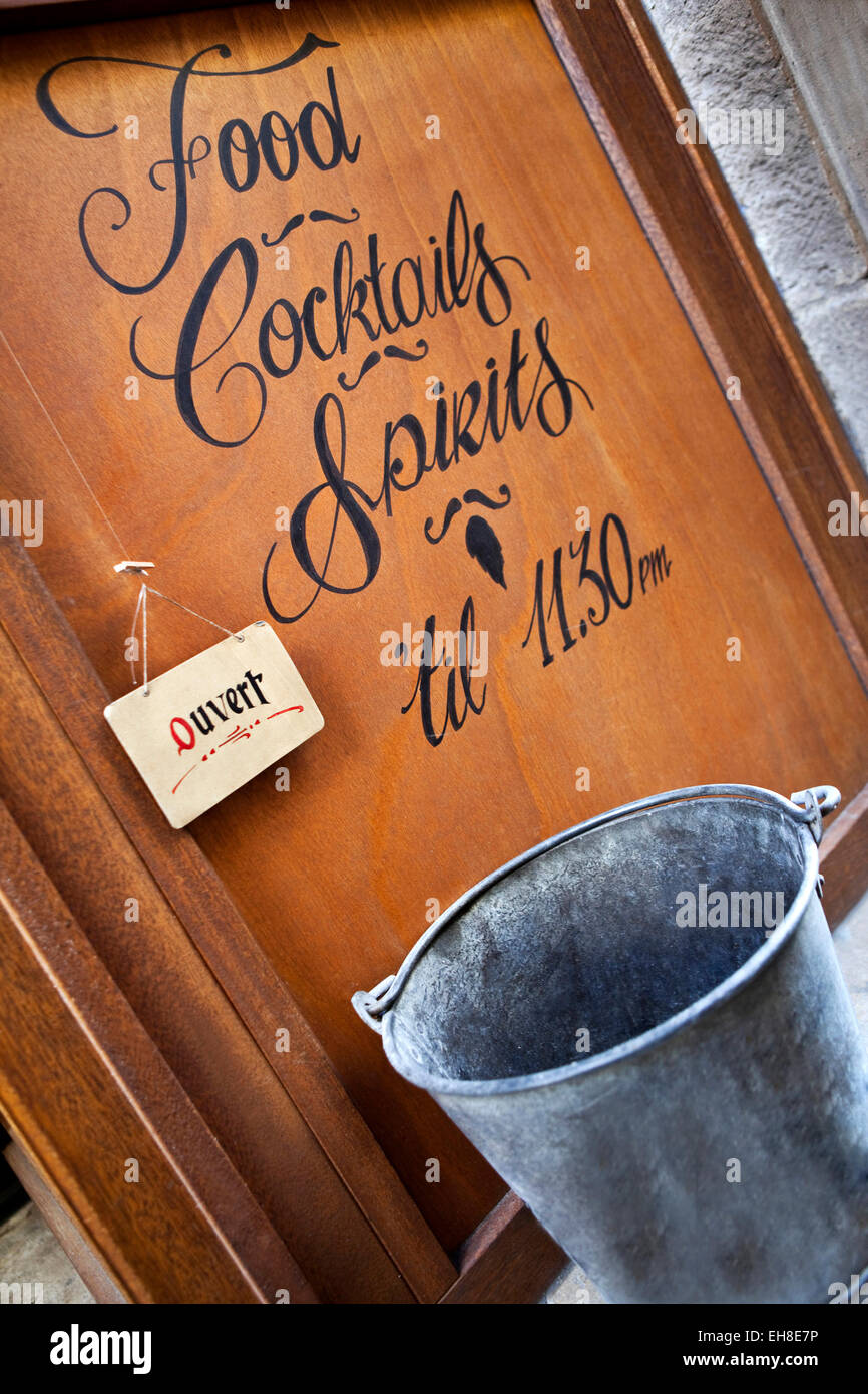 Signs on the facade of a French cocktail pub Stock Photo - Alamy