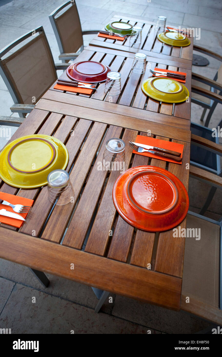 Table set up on a terrace in summer Stock Photo - Alamy