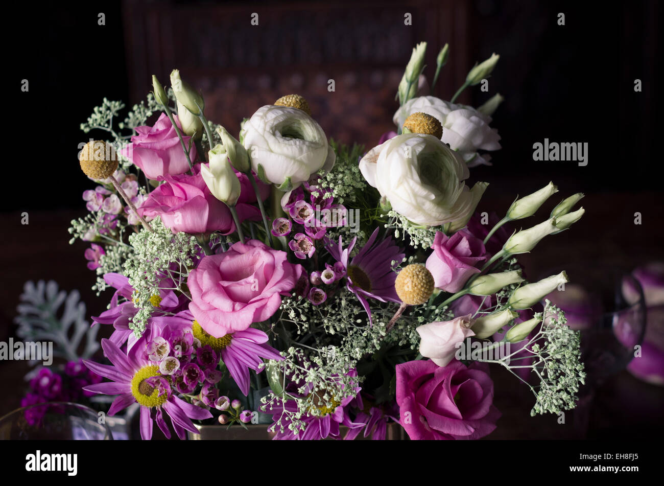 colorful spring flowers bouquet on a wood background Stock Photo - Alamy
