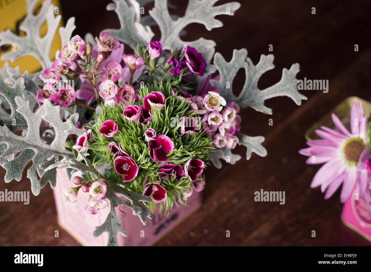 colorful spring flowers bouquet on a wood background Stock Photo - Alamy
